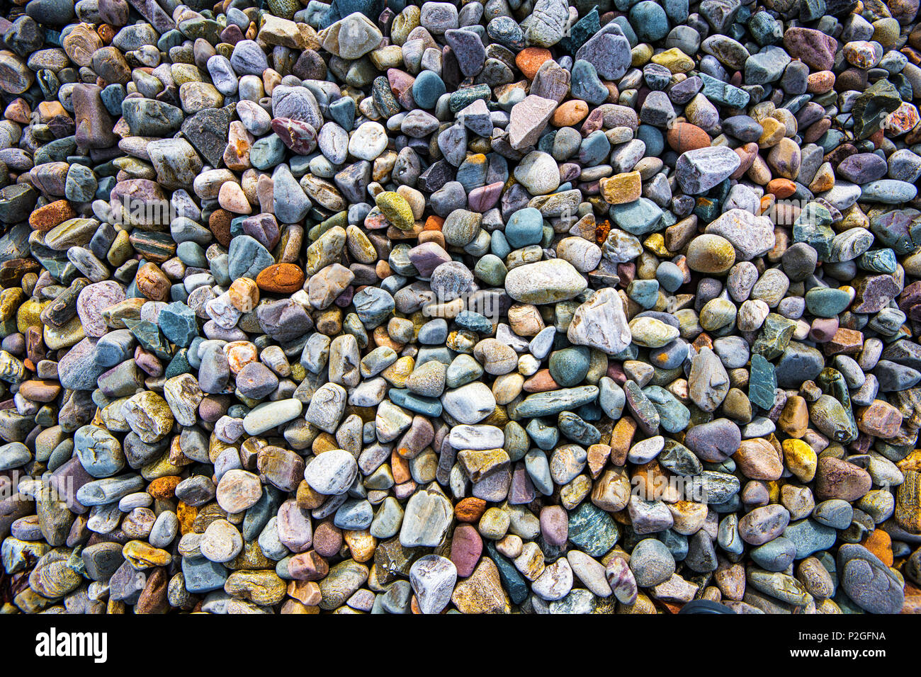 A poster showing the beautiful coloured stones on the shores of the ...