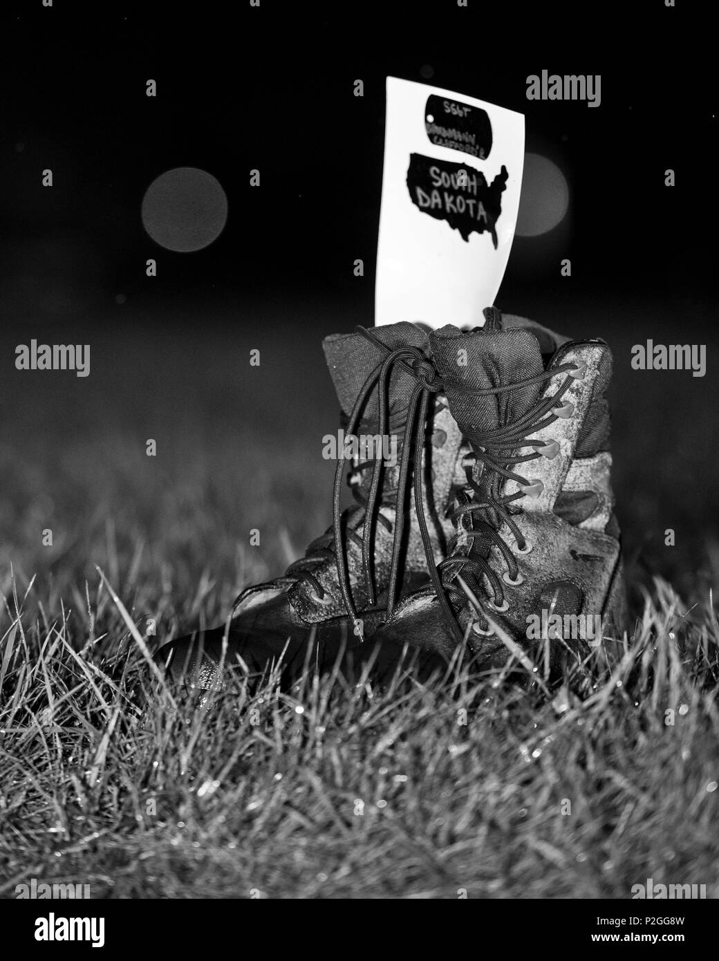 Combat boots line the outdoor track in the rain at Minot Air Force Base ...