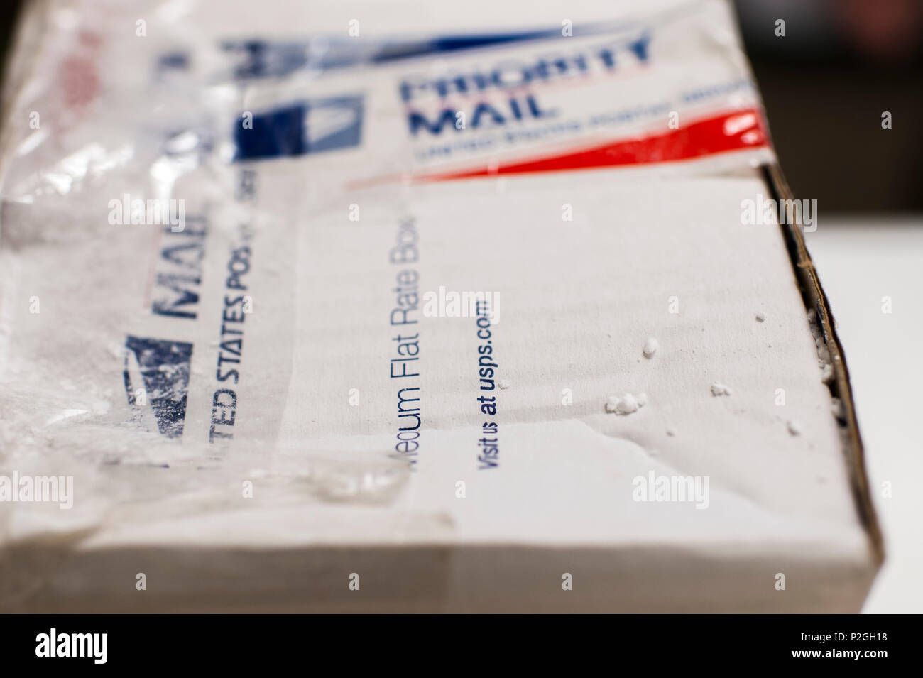 White powder residue is visible on a simulated suspicious package ...