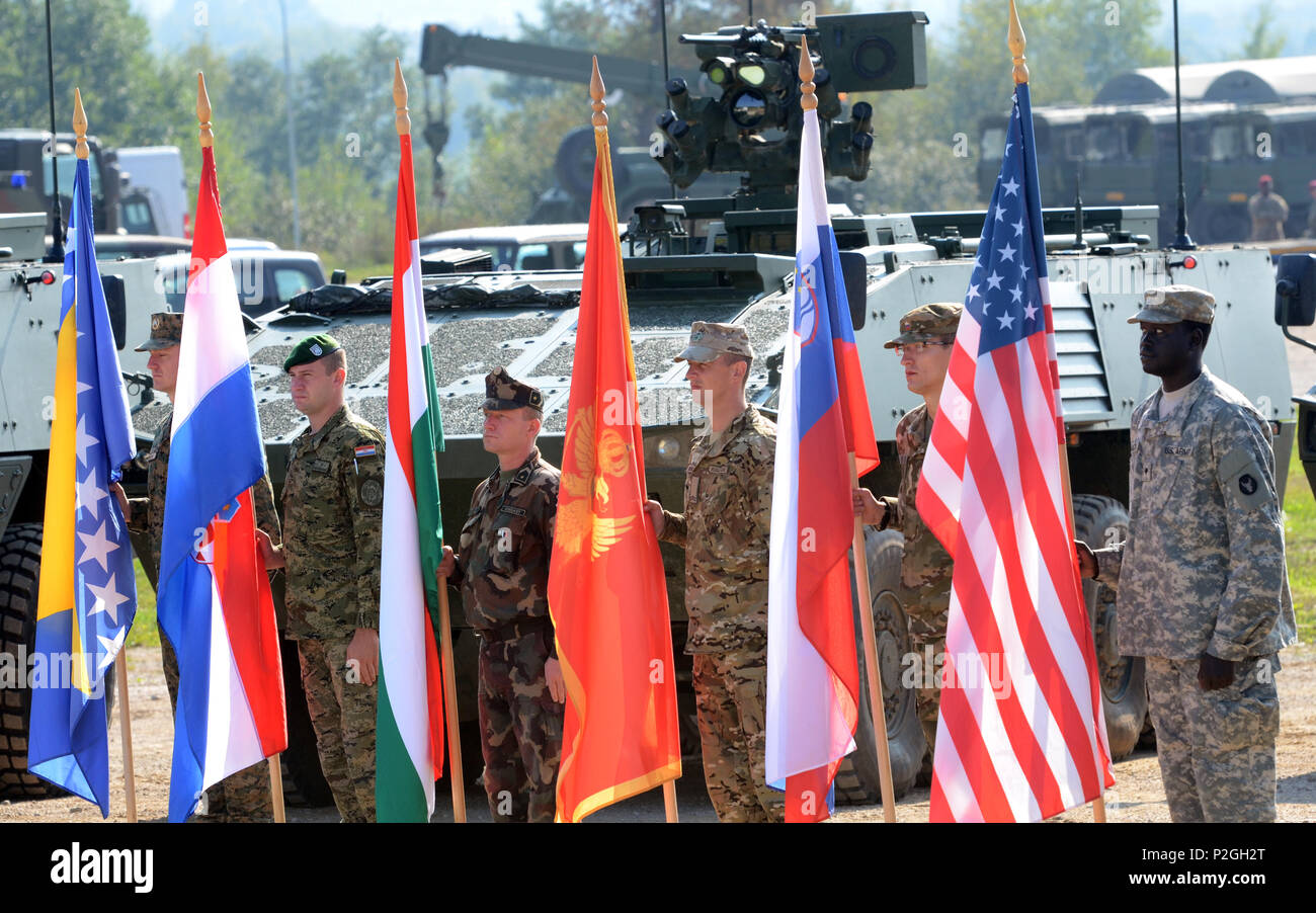 Soldiers representing NATO partner and allied nations hold thier ...