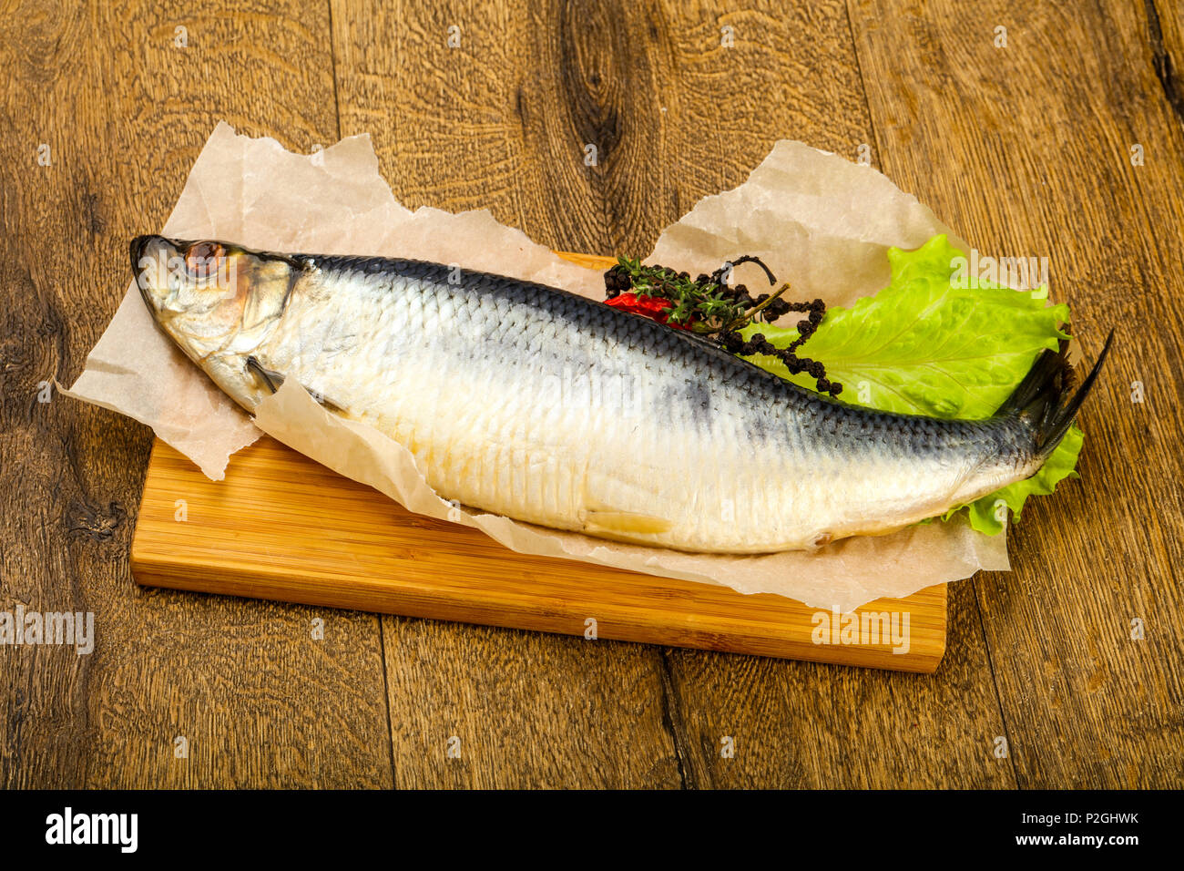 Salted Herring fish with pepper and spices Stock Photo - Alamy
