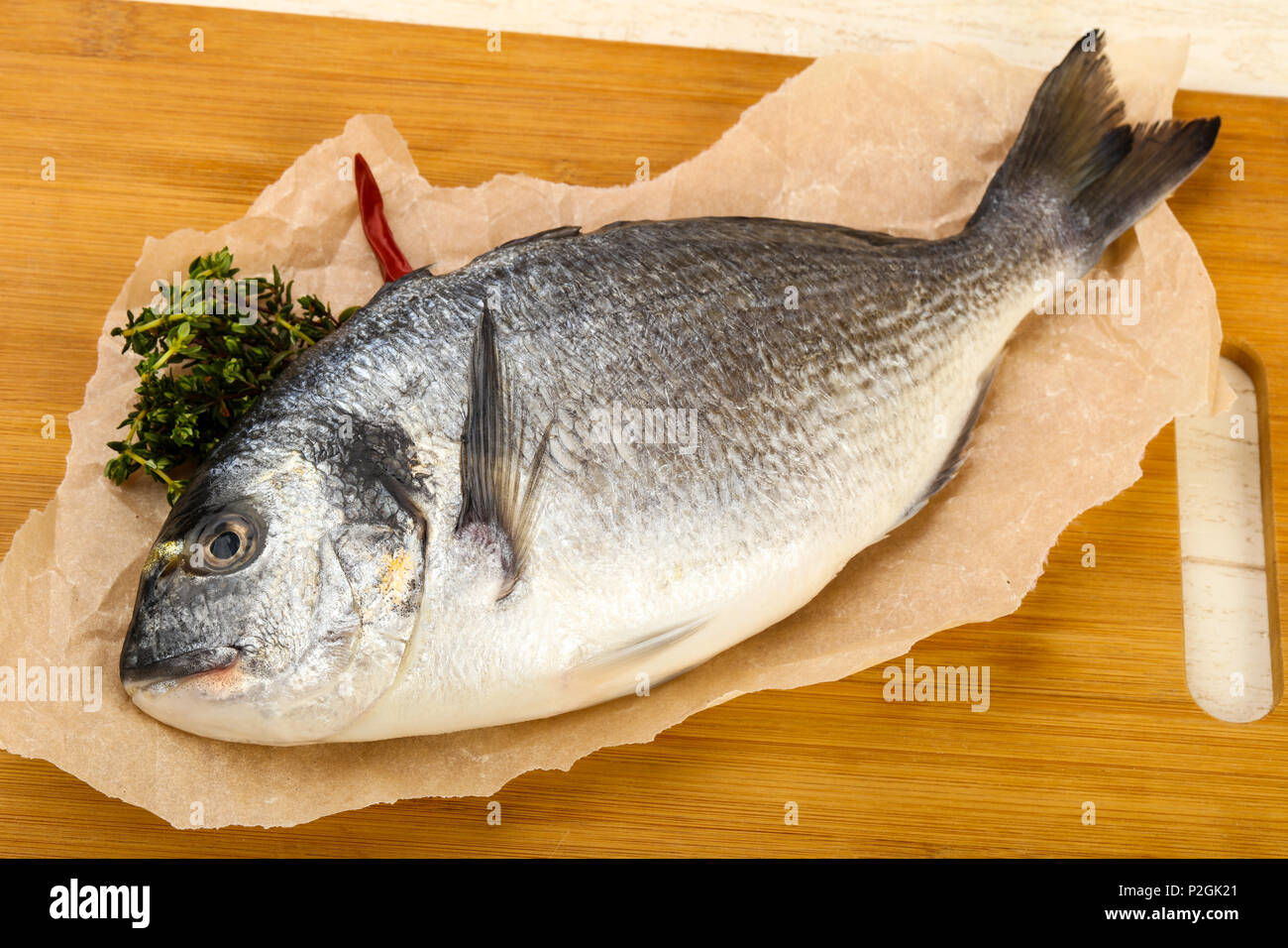 raw dorada fish - ready for cooking Stock Photo - Alamy