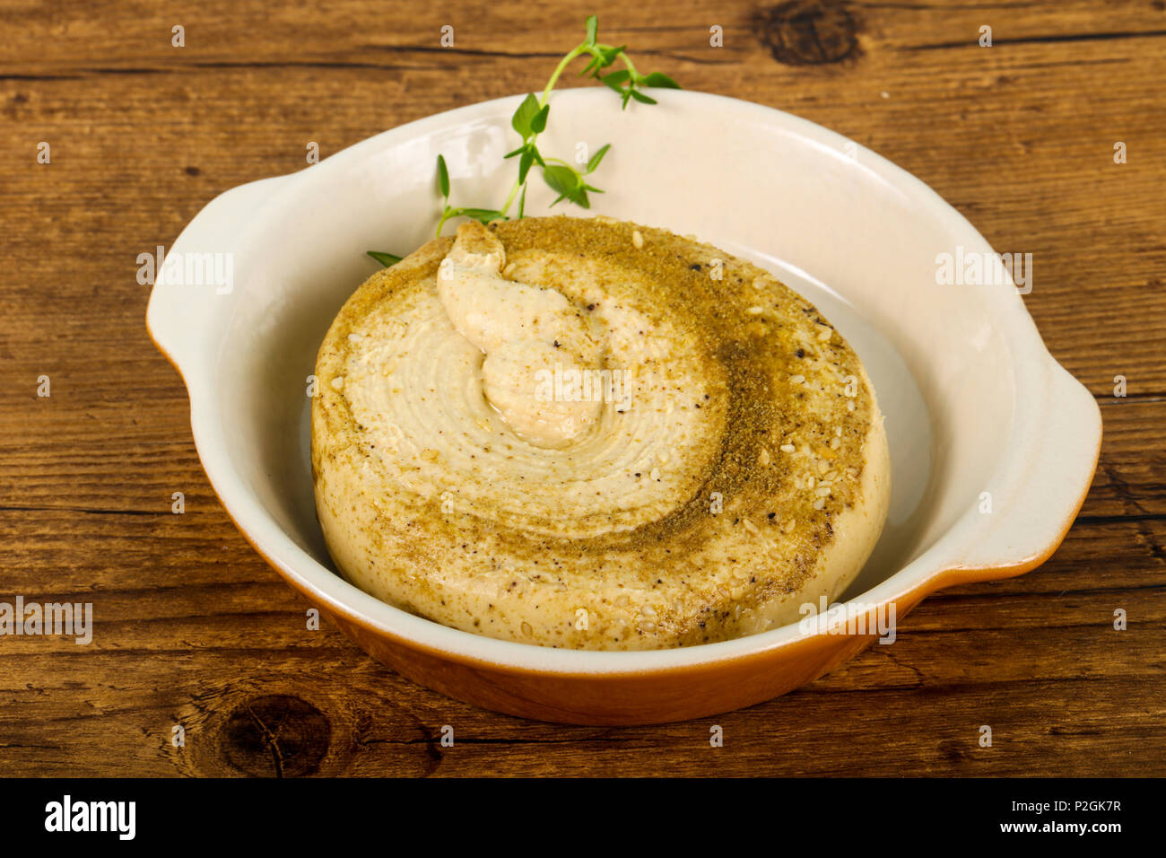 Vegetarian Humus with sesame seeds and thyme leaves Stock Photo - Alamy
