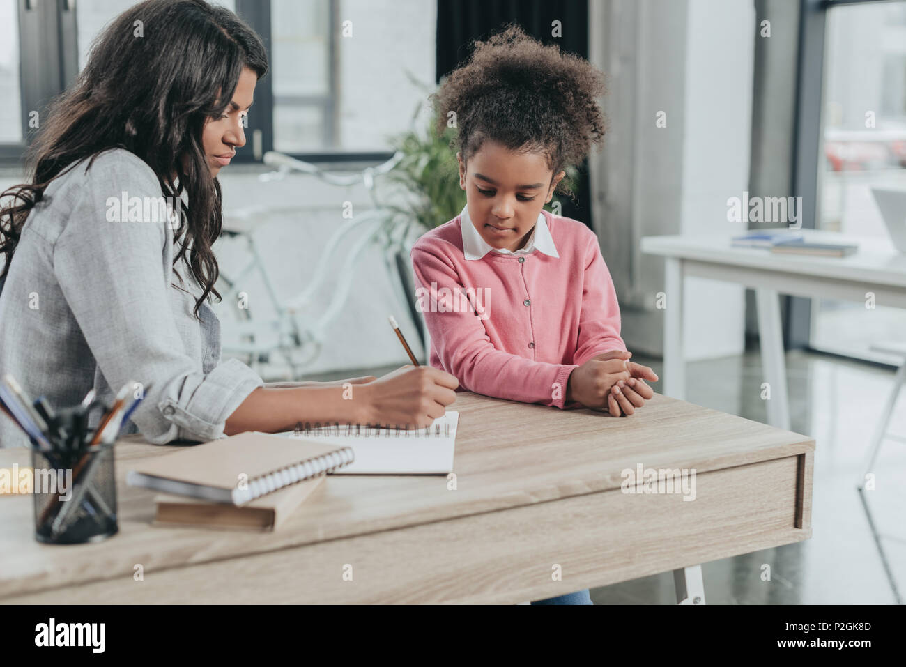 Business mother daughter homework hi-res stock photography and images ...