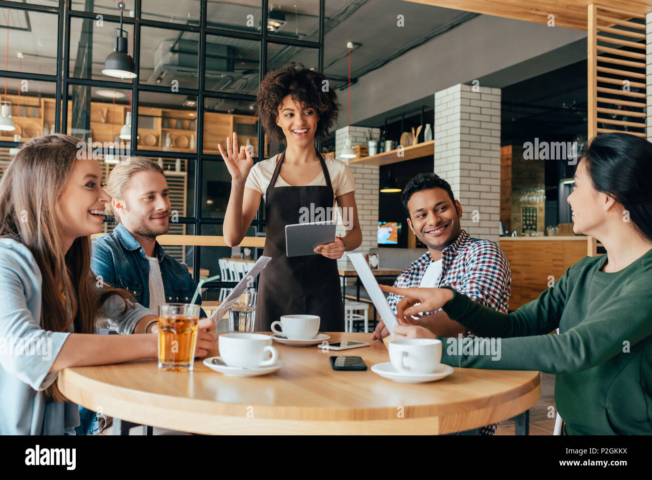 Young asian woman orders food hi-res stock photography and images - Alamy