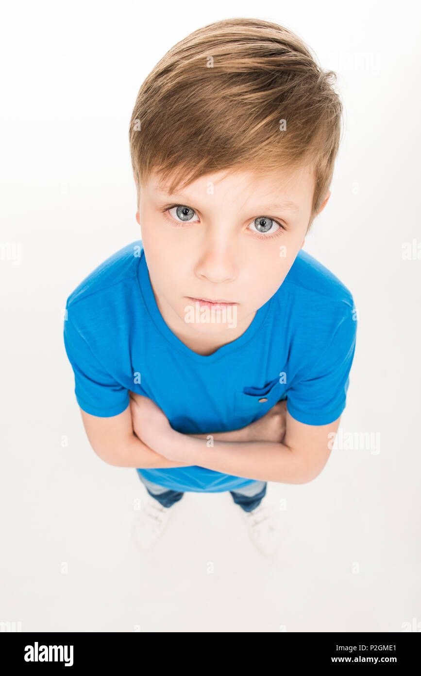 Boy standing alone arms crossed hi-res stock photography and images - Alamy