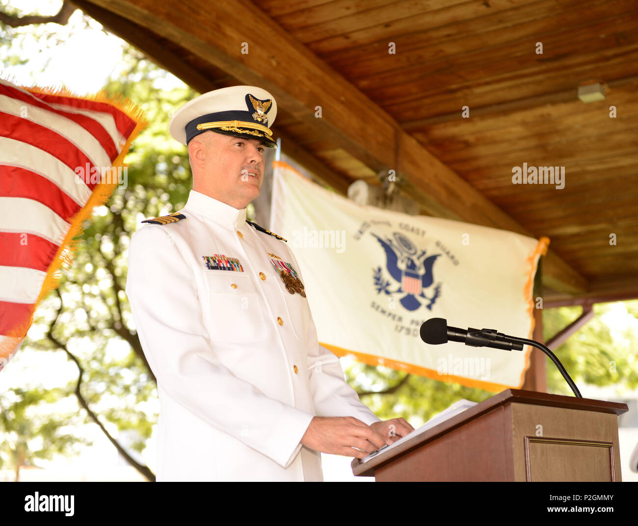 U.S. Coast Guard Capt. Andrew Grenier, speaks during a change of ...