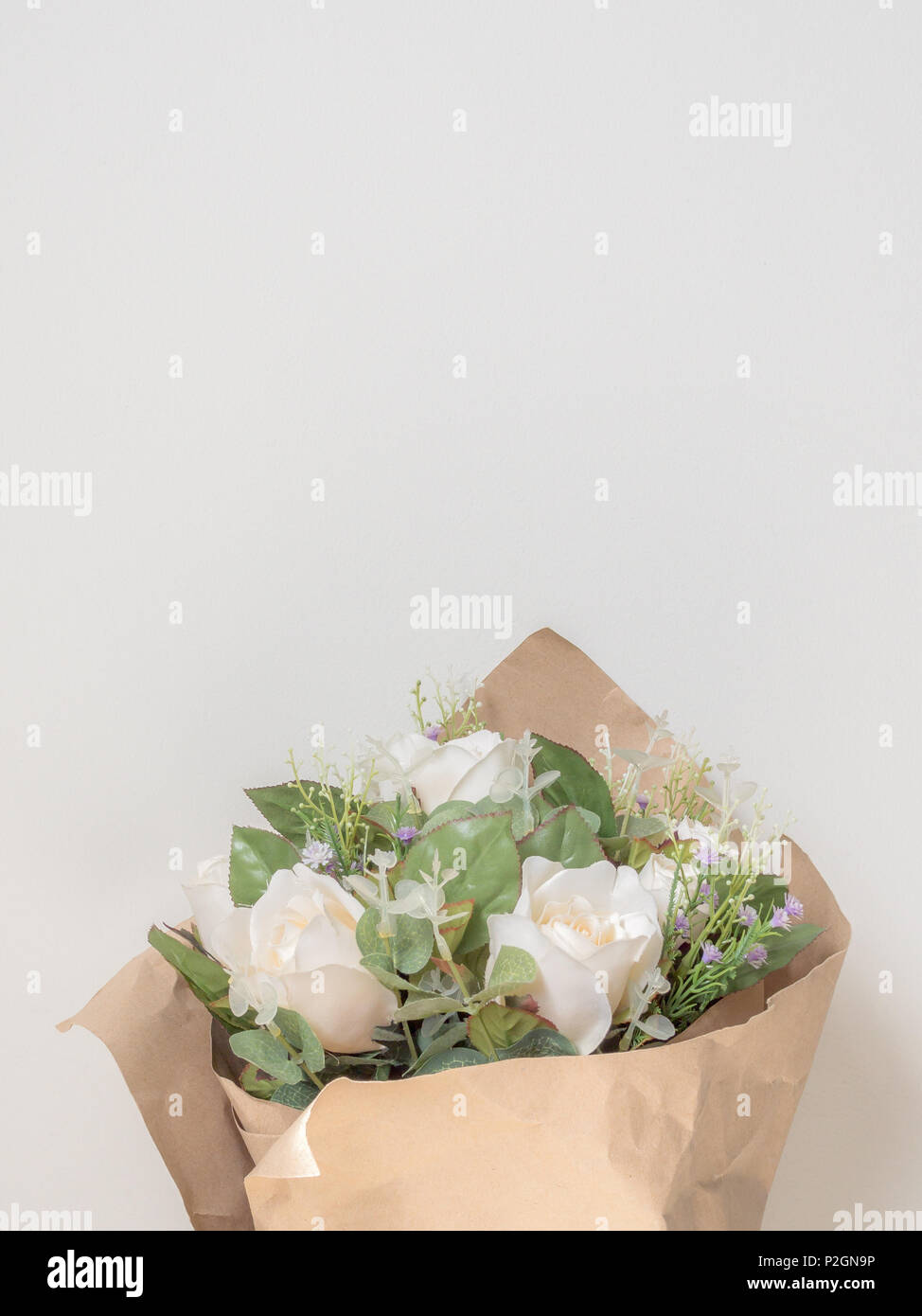 Artificial White Roses Bouquet in Wrapping Brown Craft Paper Isolate on ...