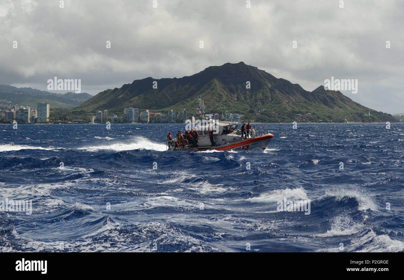 U.S. Coast Guardsman from Coast Guard Station Honolulu transport ...