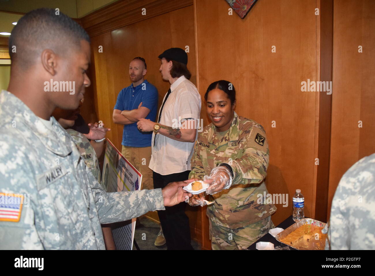Sgt. Brenda Collins, 2-1 ADA Battalion, serves arepa de maiz, a popular ...