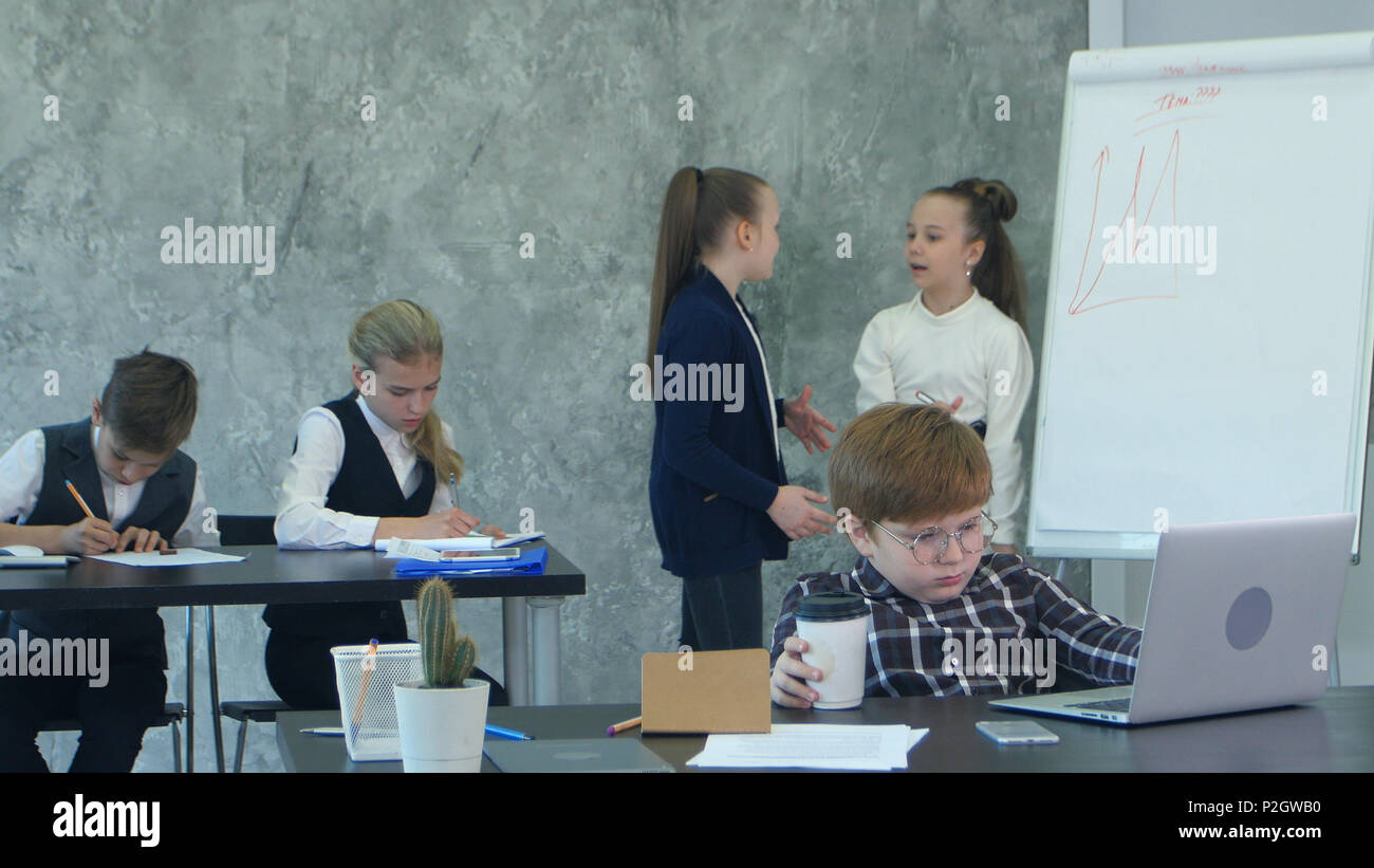 Business kids working process in office Stock Photo - Alamy
