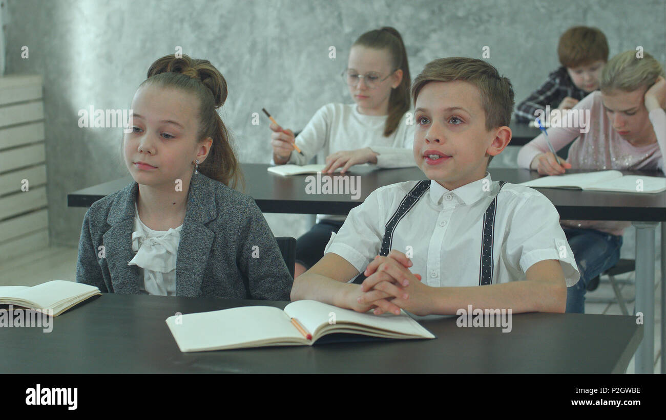 Schoolgirls in classroom students working hi-res stock photography and ...