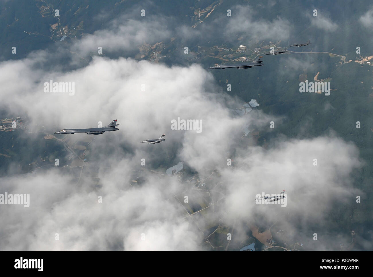 Two B-1B Lancers from Andersen Air Base, Guam, fly in formation with ...