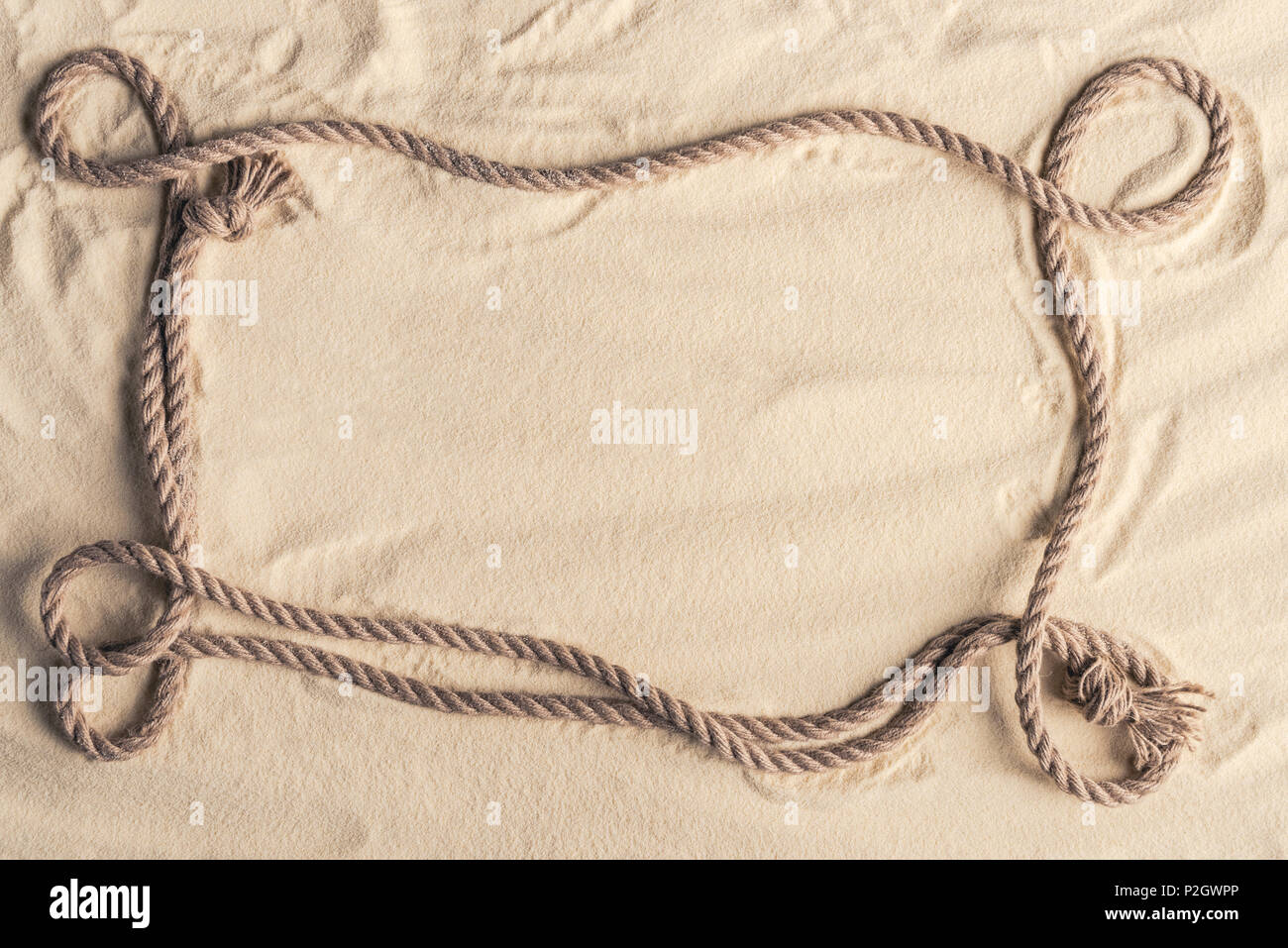 Frame of ship rope on sandy beach Stock Photo - Alamy