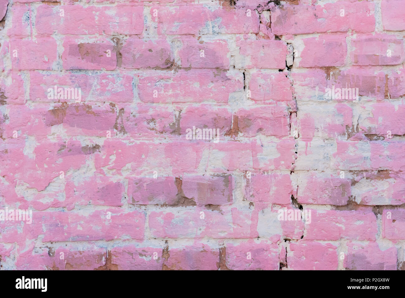 old pink brick wall background, full frame view Stock Photo - Alamy