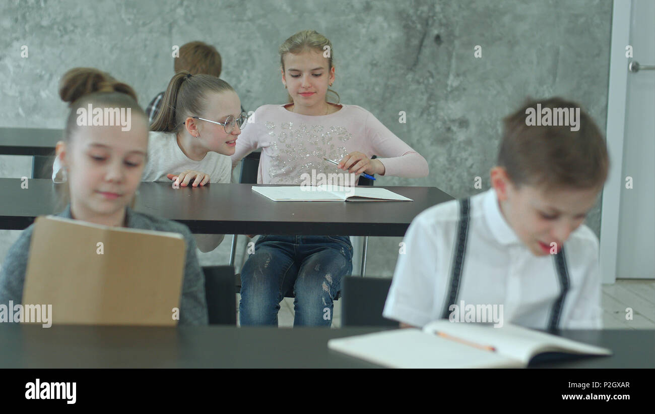 Group of students in class during break Stock Photo - Alamy