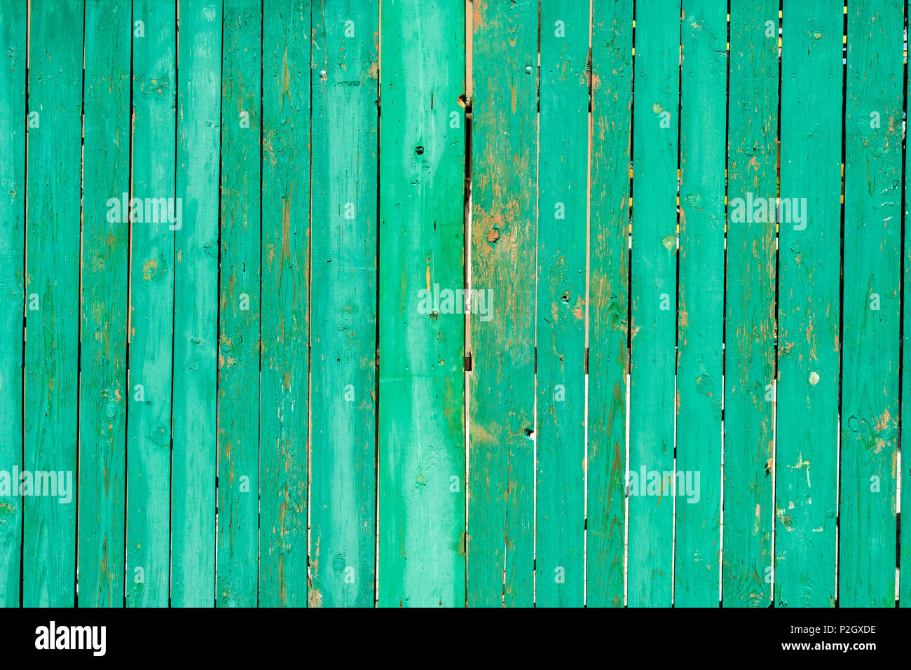 old scratched green wooden fence background Stock Photo - Alamy