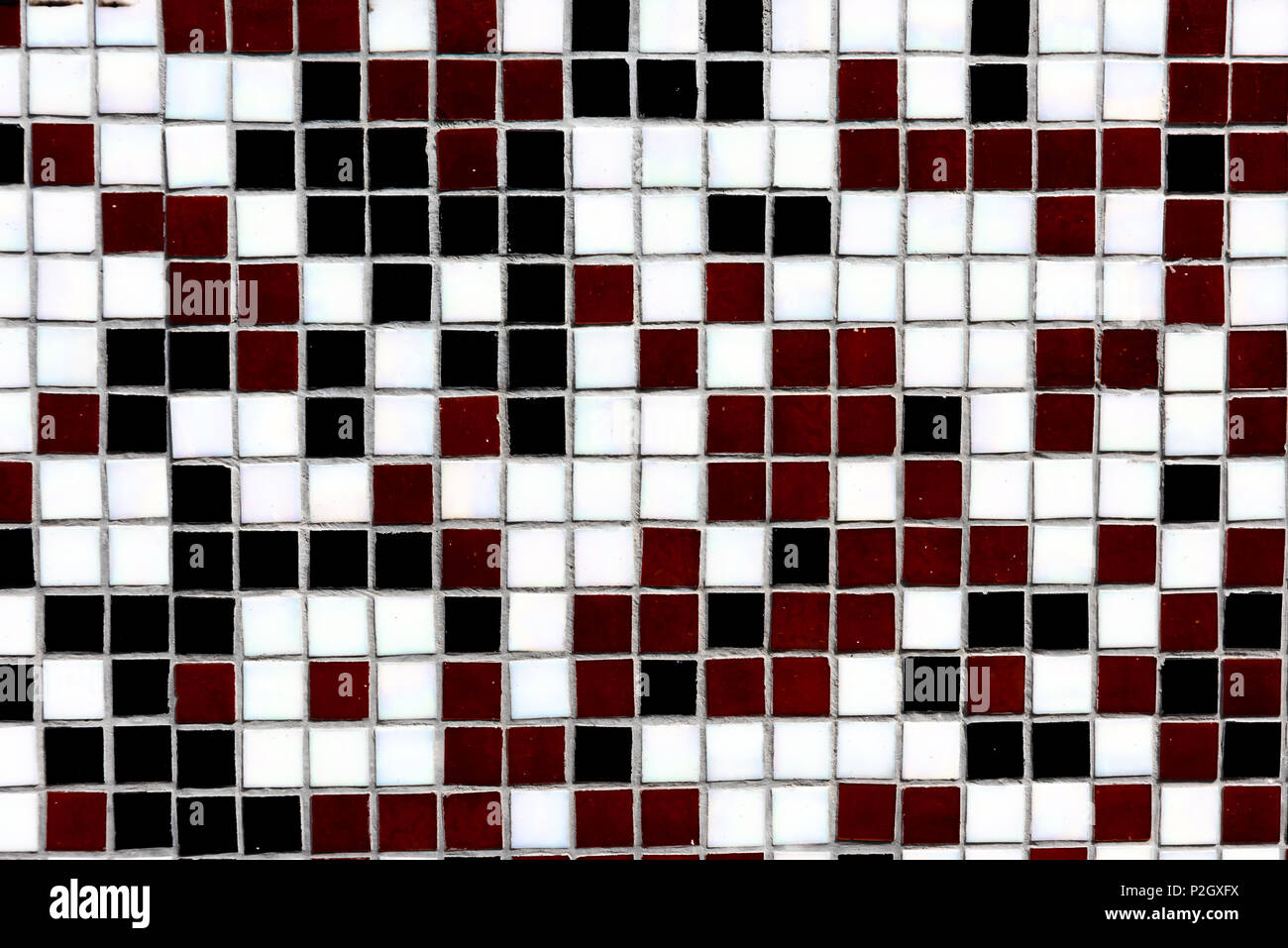 close-up view of black, white and maroon decorative tiles background ...