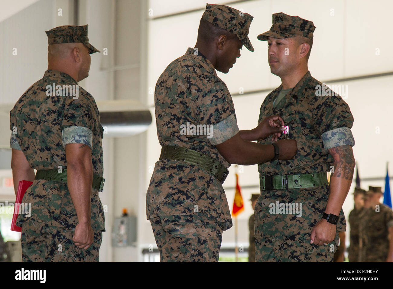 U.S. Marine Corps Lt. Col. Quentin Vaughn, center, commanding officer ...