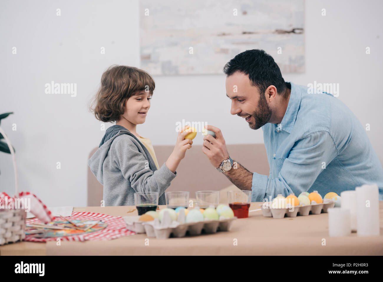 father and son doing easter egg knocking Stock Photo - Alamy