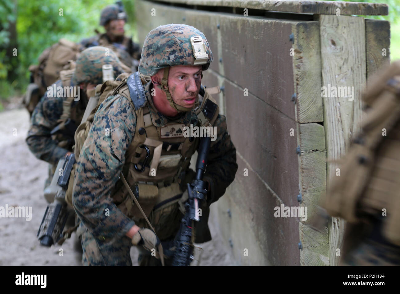 Corporal Christopher Rowe prepares to enter a compound during a ...