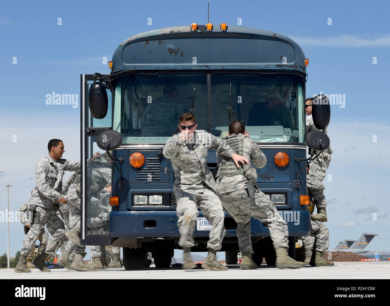 97th Security Forces Squadron members practice securing a bus at Altus ...