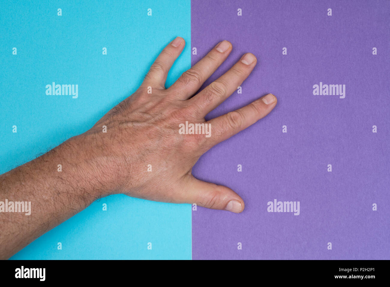 a hand on a two-color surface Stock Photo - Alamy
