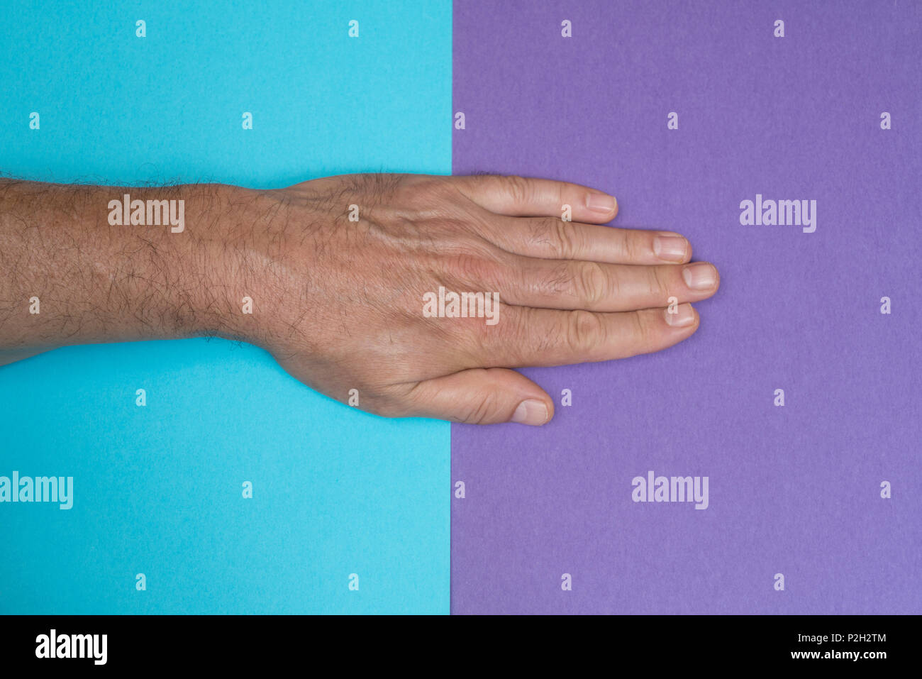 a hand on a two-color surface Stock Photo - Alamy