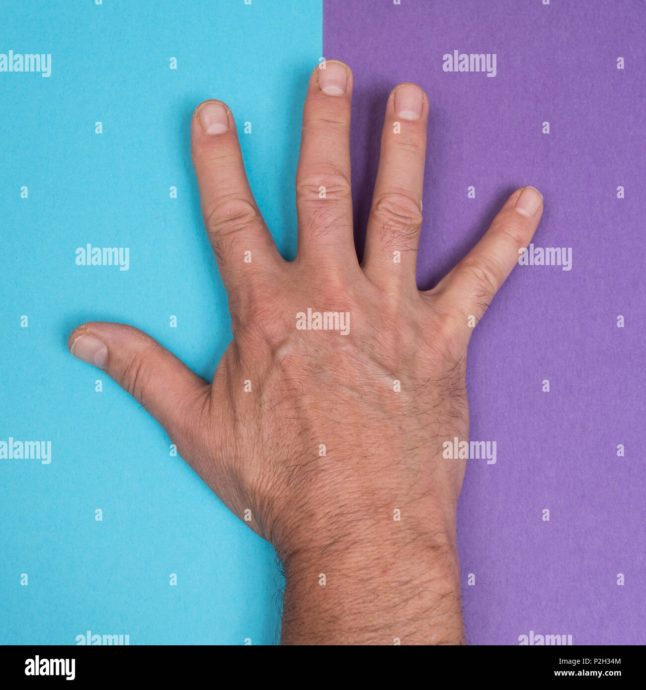 a hand on a two-color surface Stock Photo - Alamy