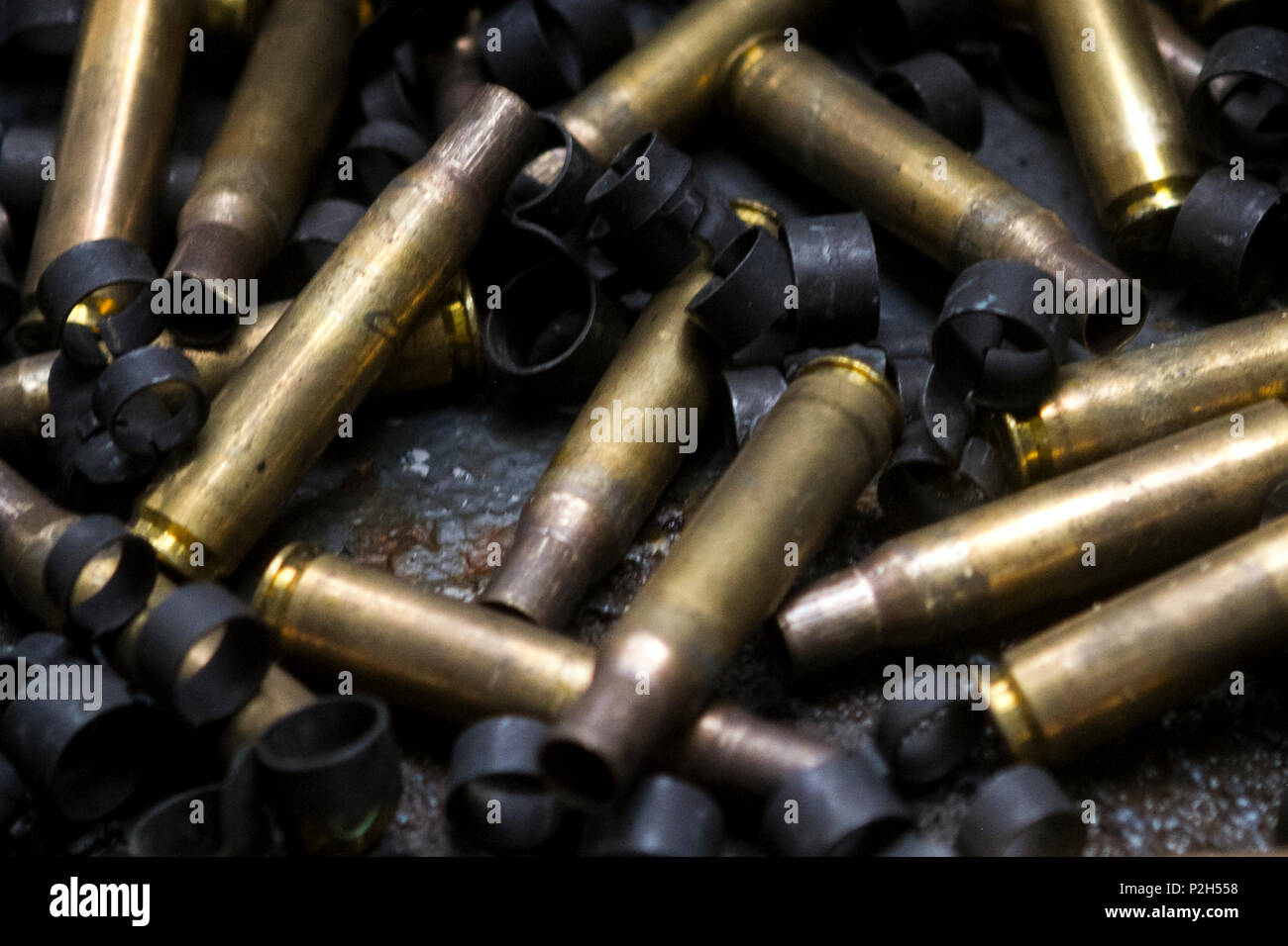 Fifty-caliber machine gun links and shell casings litter the port side ...