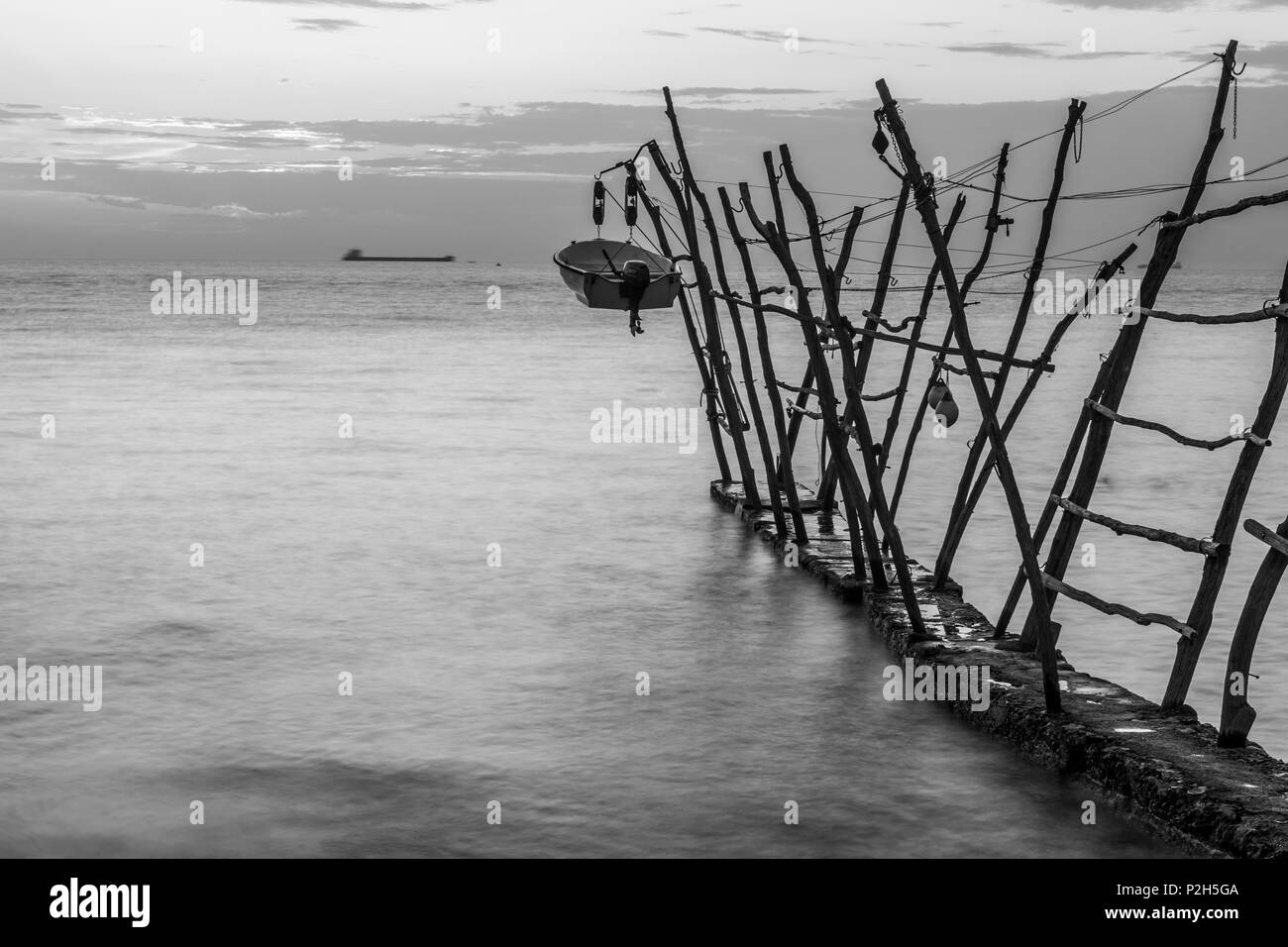 Panorama of beautiful sunset at sea. Traditional hanging boat Stock ...