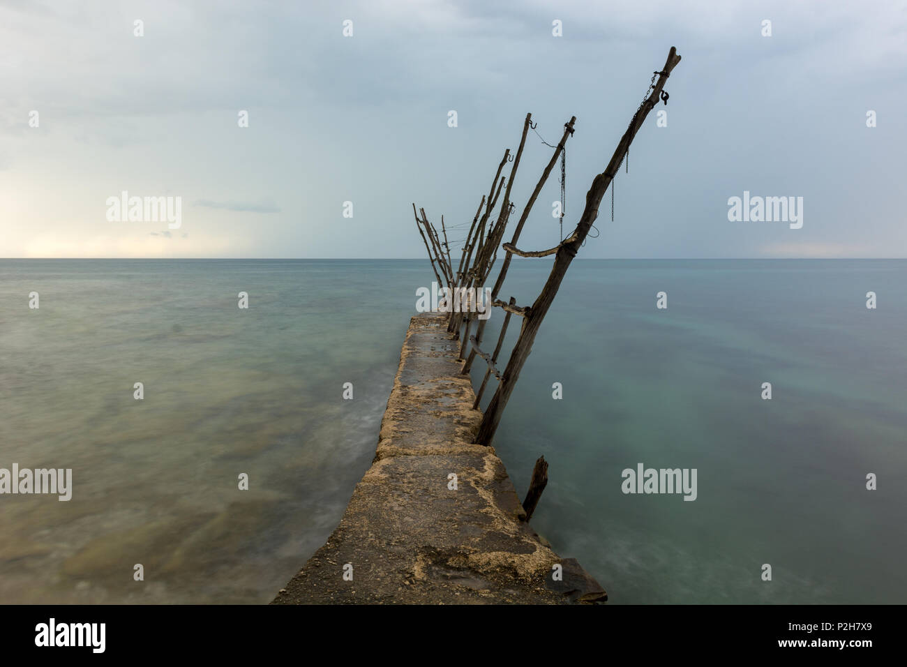 Overcast ocean view with long exposure technique. Traditional wooden ...