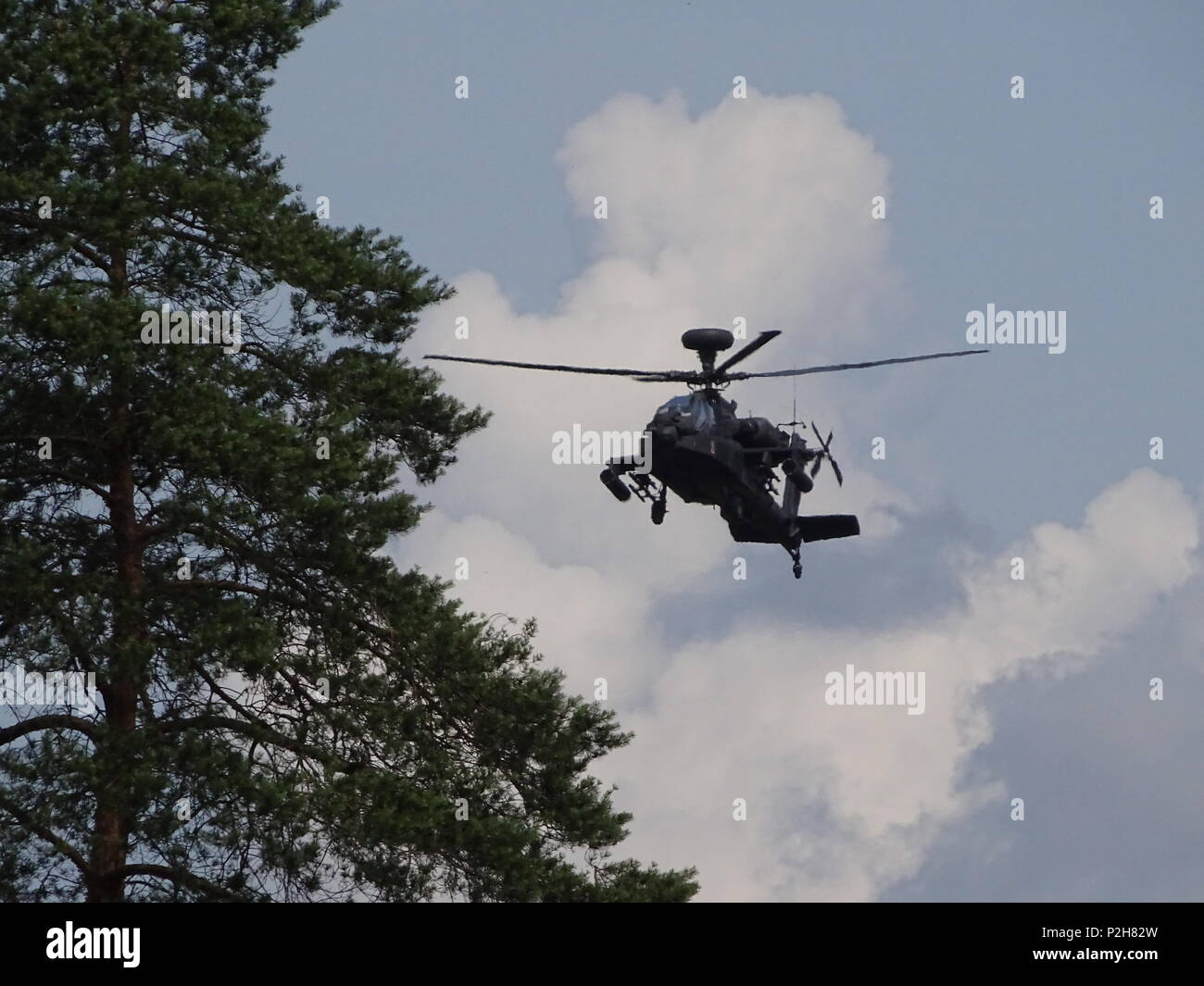 An American Apache attack helicopter takes part in the multinational ...