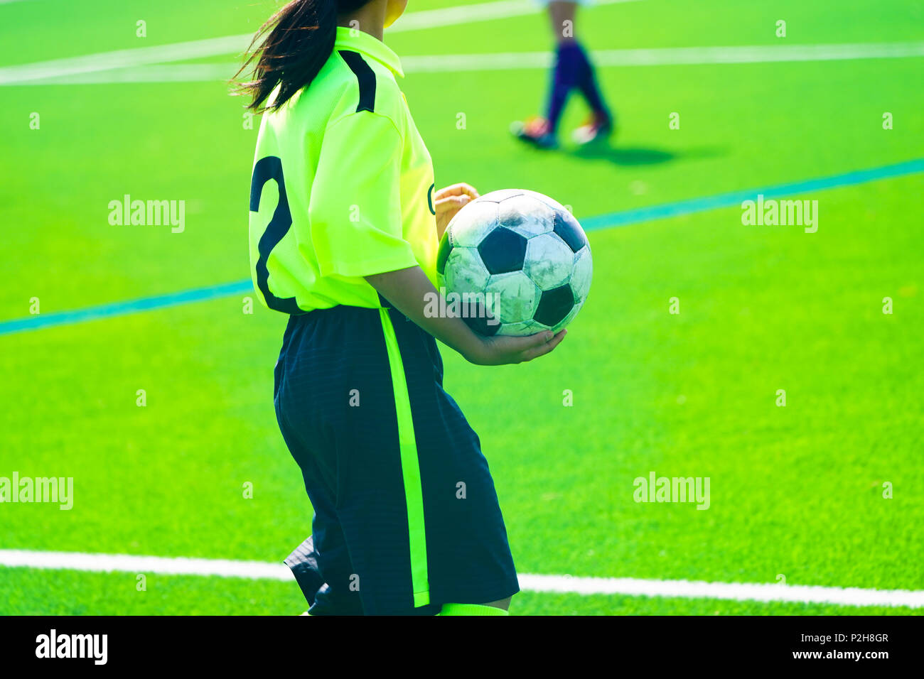 Girl Throwing Soccer Ball High Resolution Stock Photography and Images ...