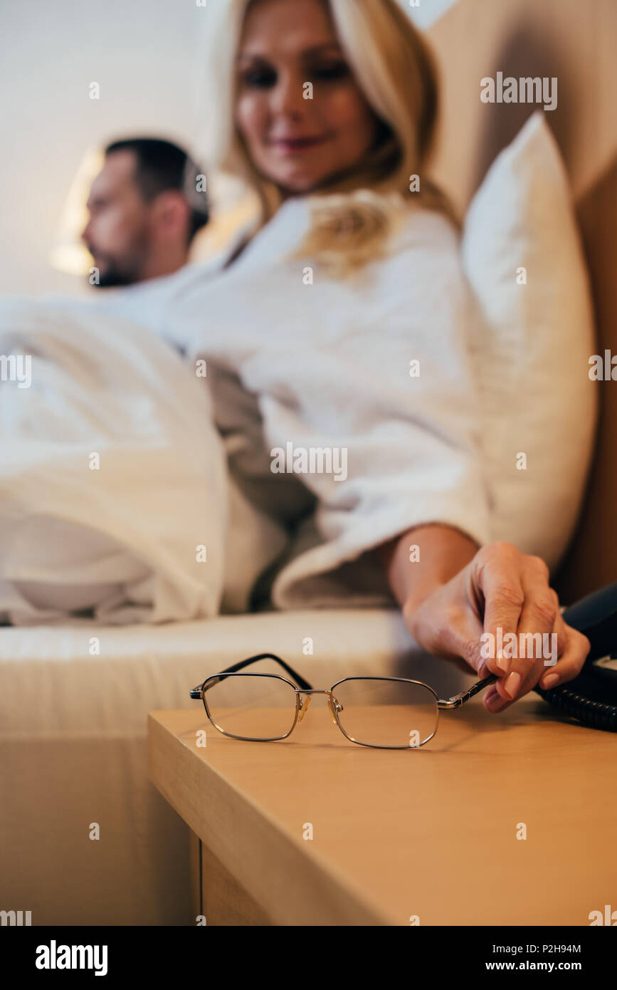 Woman putting eyeglasses hi-res stock photography and images - Alamy