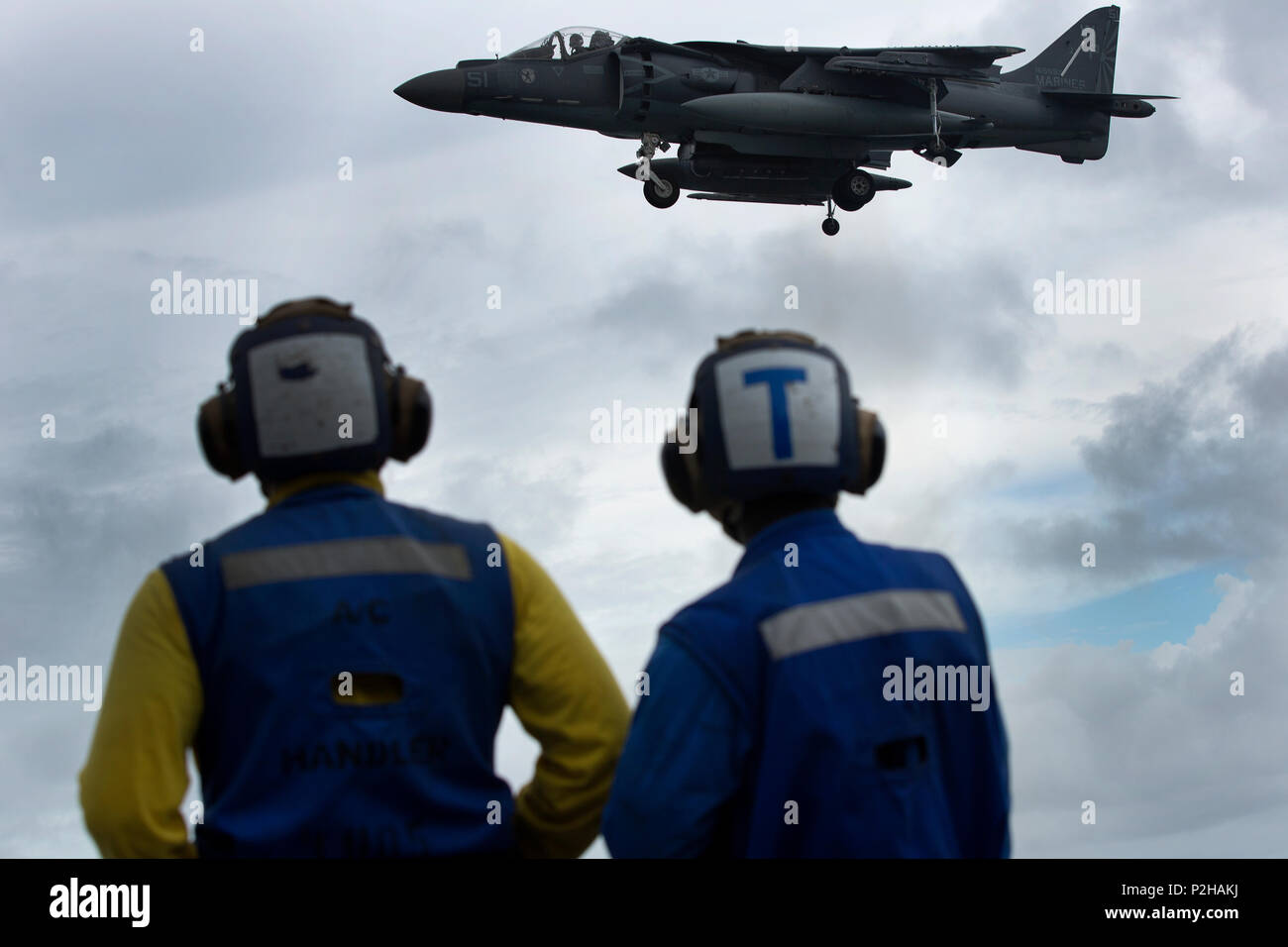 An AV-8B Harrier conducts flight operations over USS Bataan (LHD-5 ...