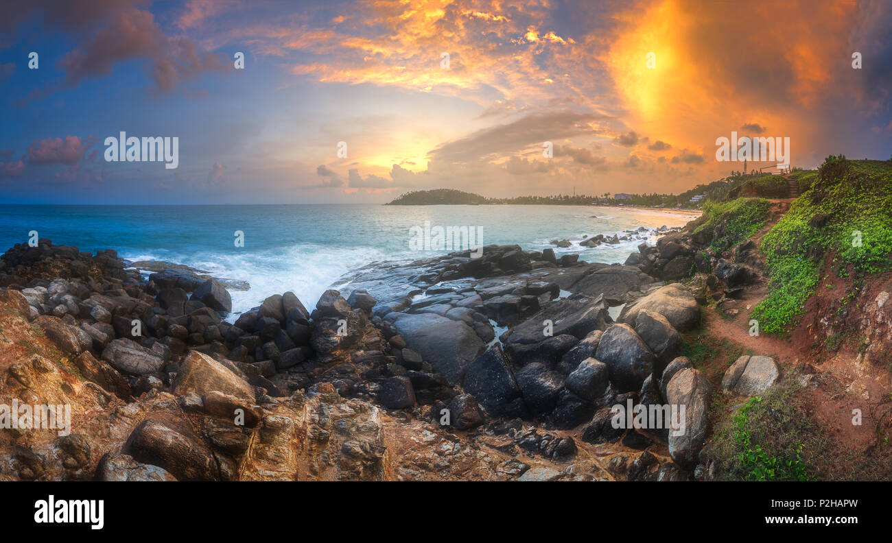 Tropical beach with rocks on sand coast of ocean Stock Photo - Alamy