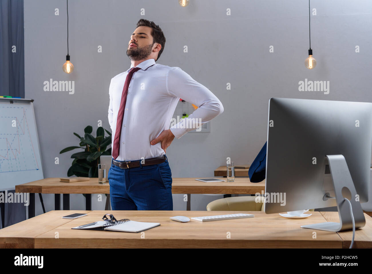 Stretching in office hi-res stock photography and images - Alamy