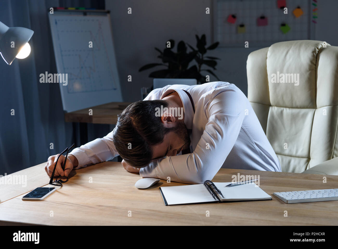 tired businessman sleeping at working table Stock Photo - Alamy