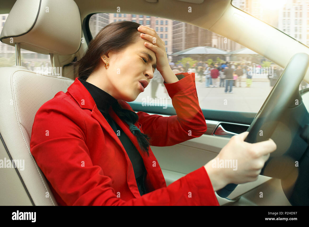 Driving around city. Young attractive woman driving a car Stock Photo ...