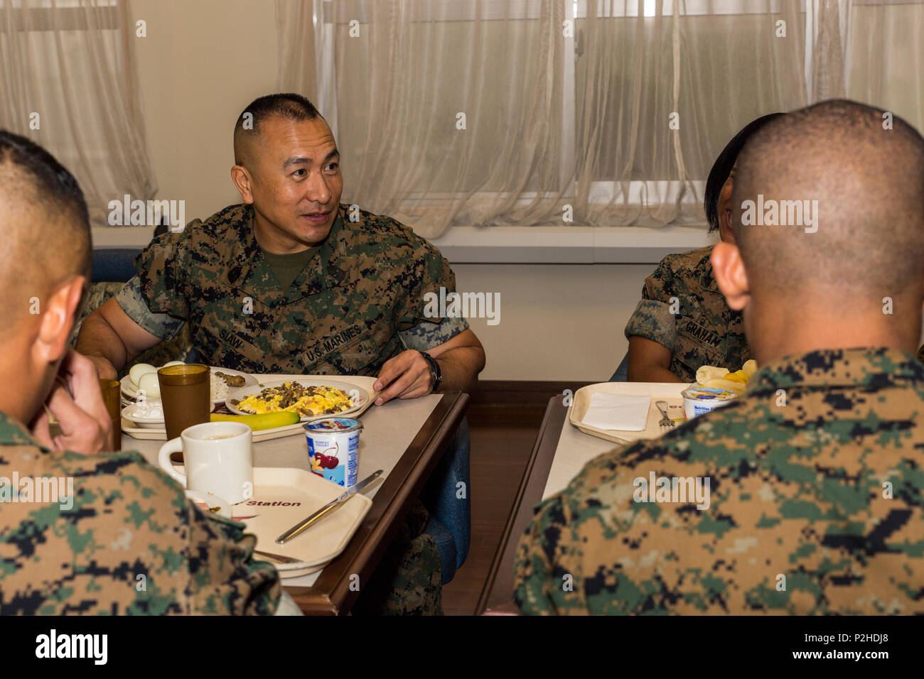 U.S. Marine Corps Sgt. Maj. Peter A. Siaw, left, Marine Corps ...