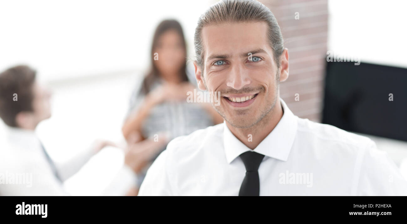 successful young business men on blurred background Stock Photo - Alamy