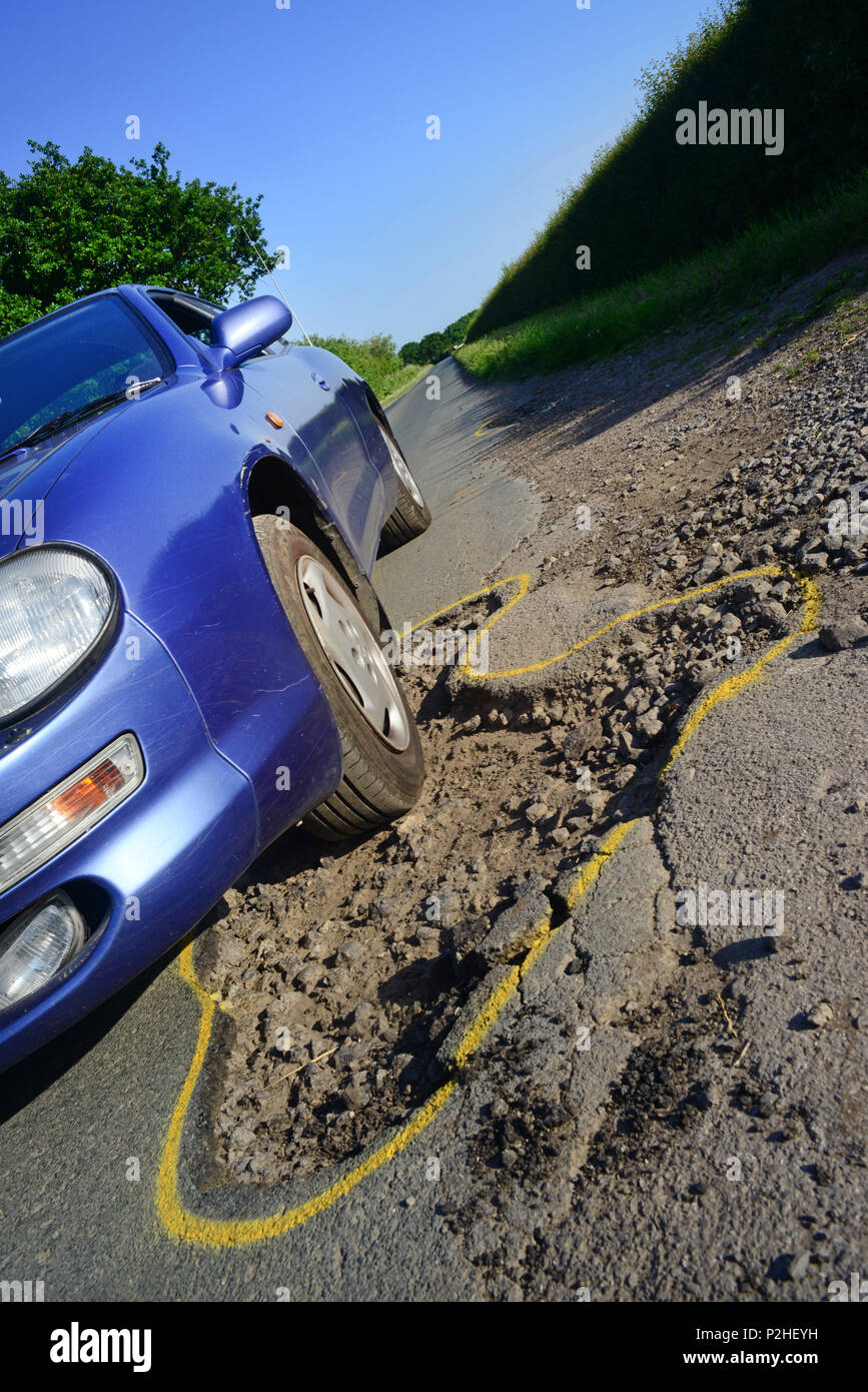Big potholes on road hi-res stock photography and images - Alamy