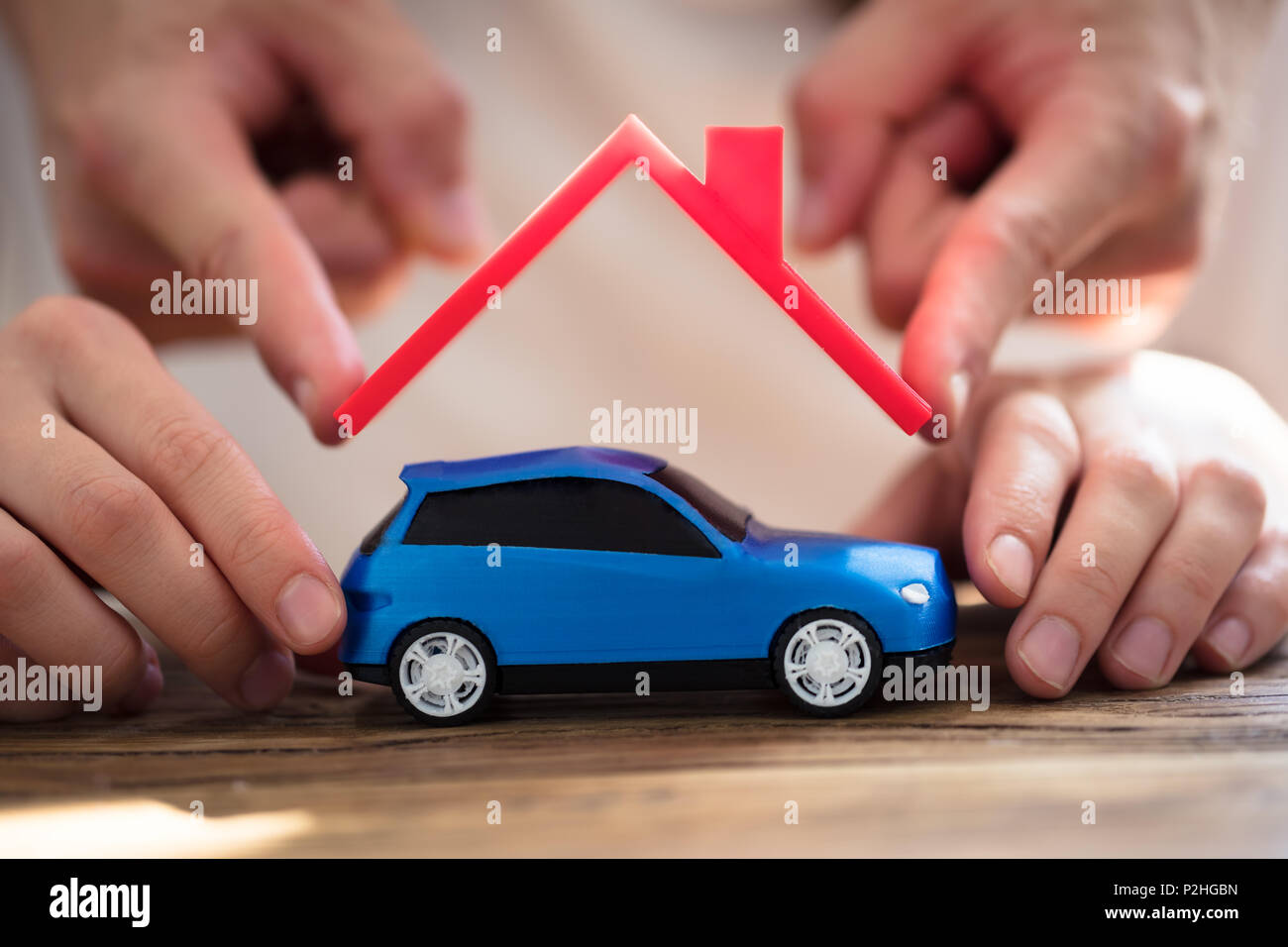 Human hand holding toy car hi-res stock photography and images - Alamy
