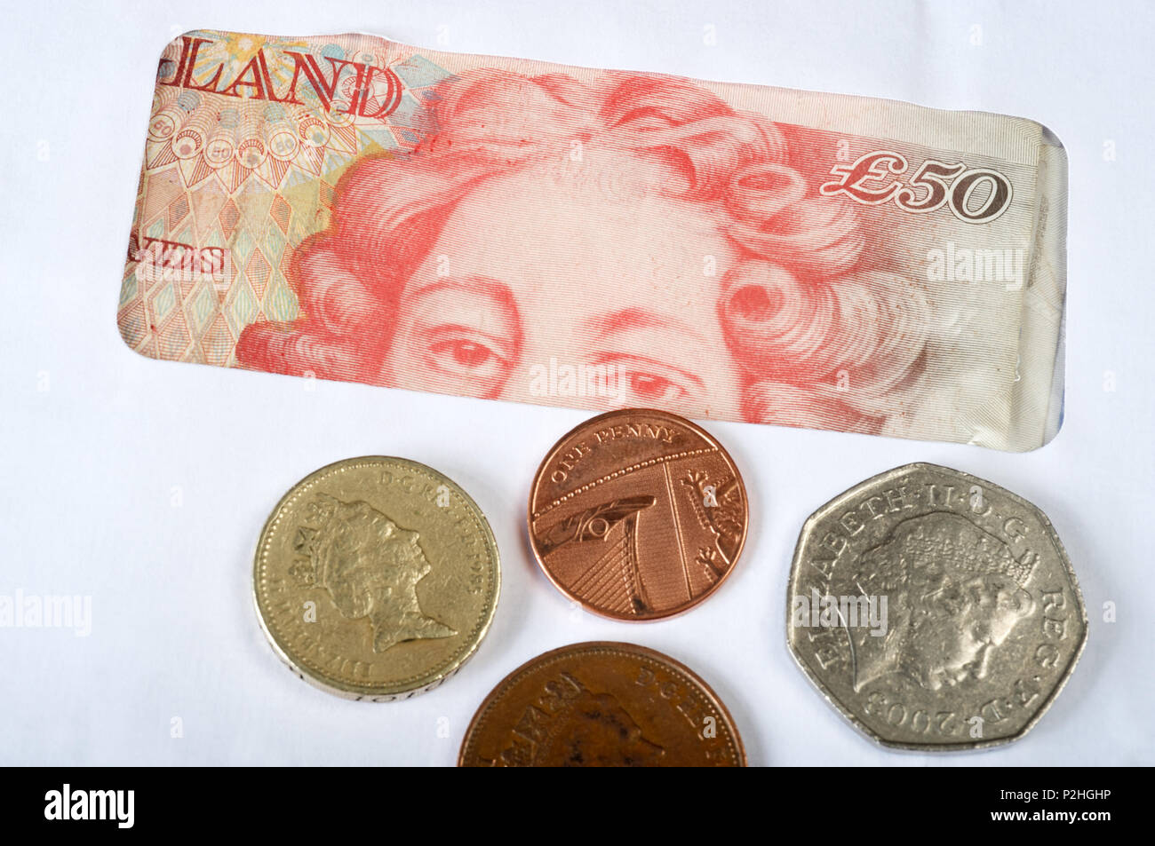 Bank of England notes and coins Stock Photo - Alamy