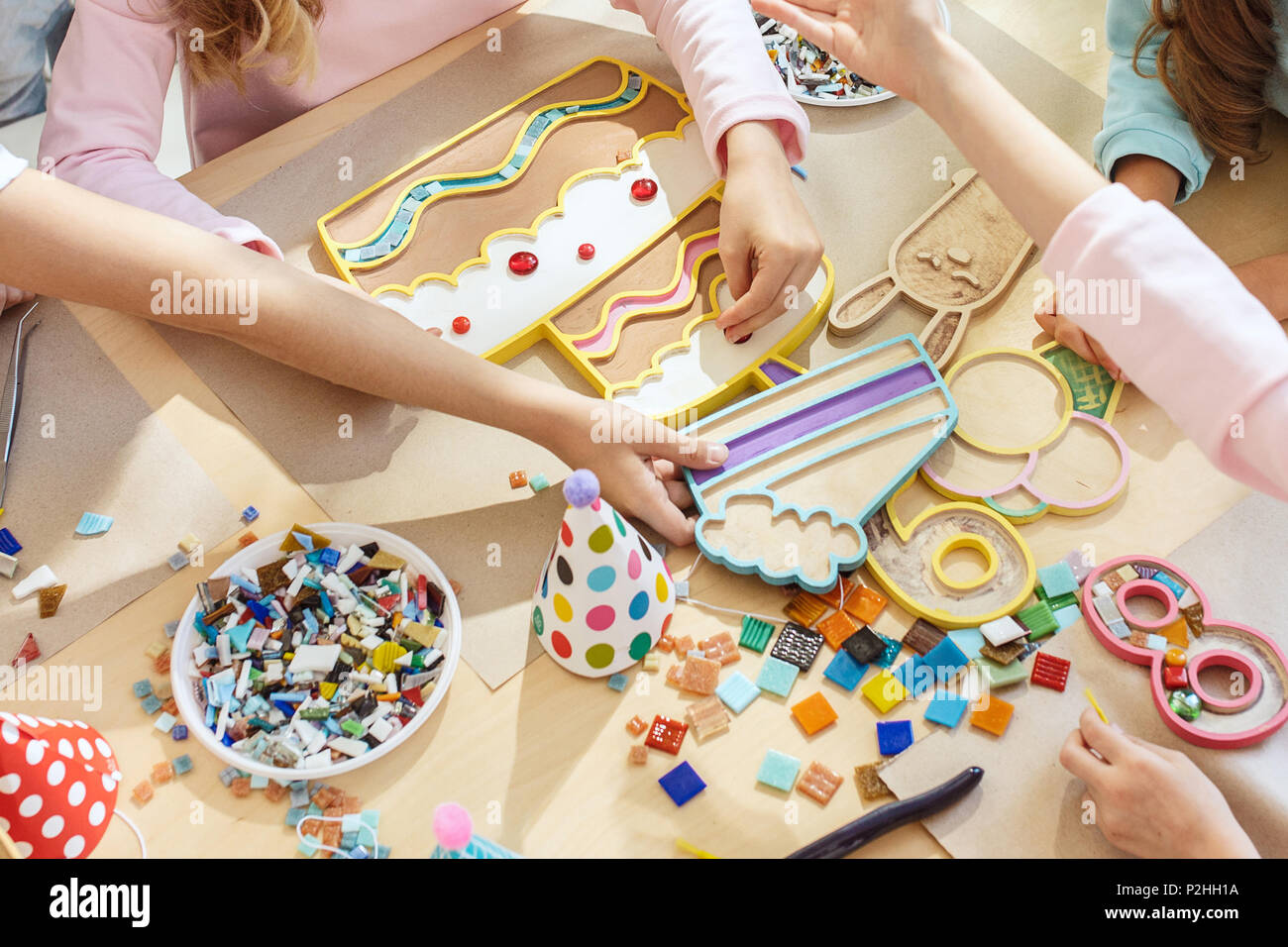 mosaic puzzle art for kids, children's creative game. two sisters are ...