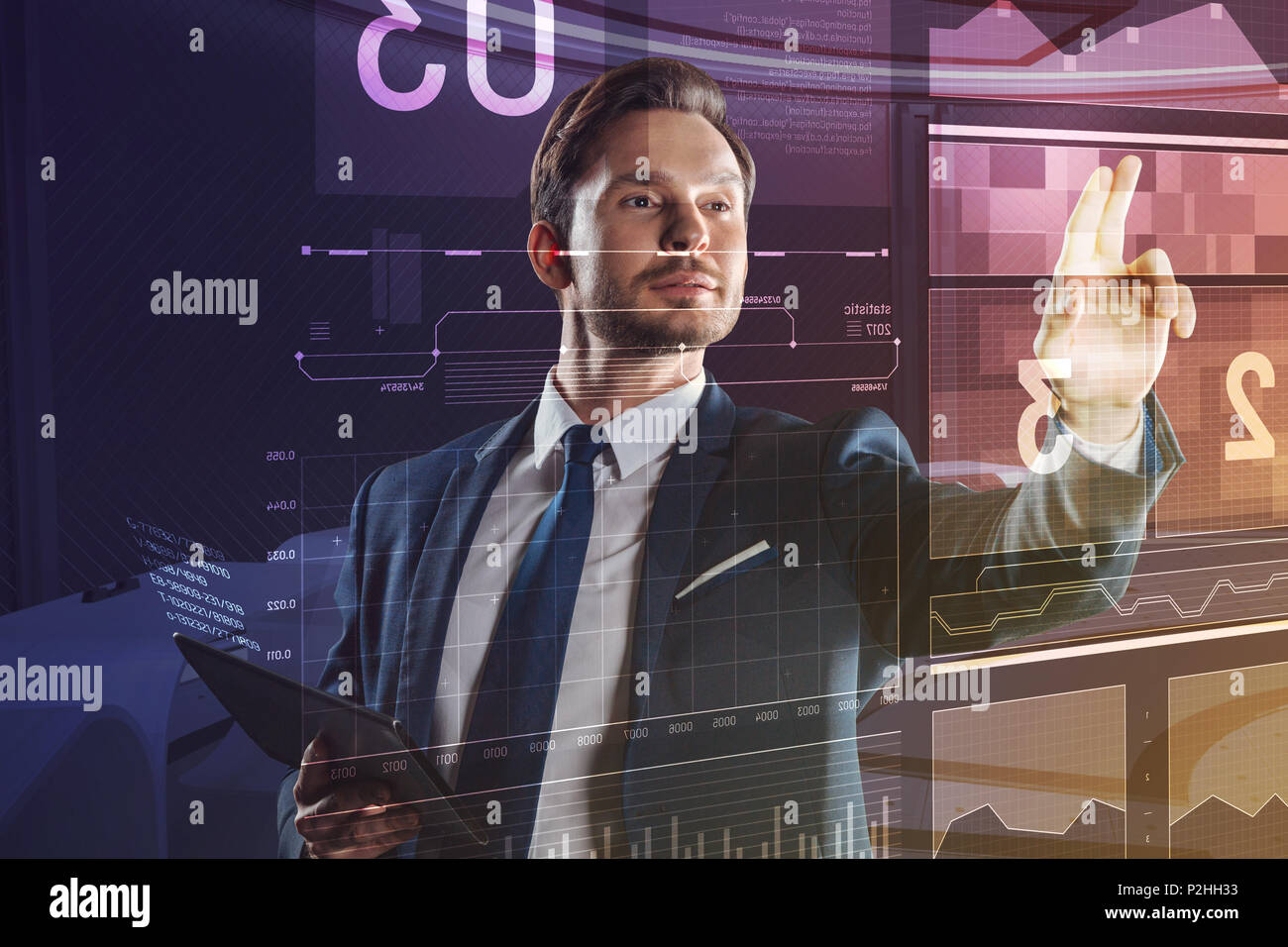Attractive elegant man smiling while touching the screen Stock Photo ... Attractive elegant man smiling while touching the screen Stock Photo ...