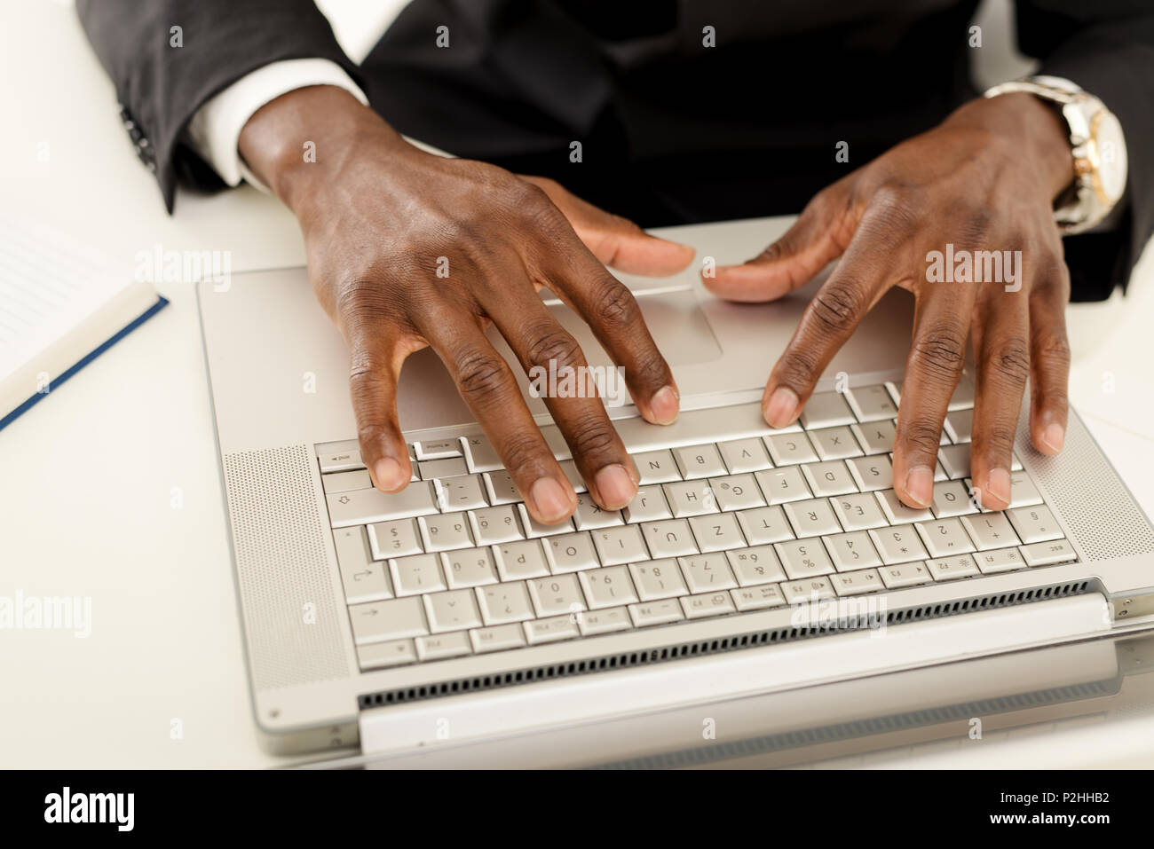 Close-up of male african hand on the keyboard of the laptop Stock Photo ...
