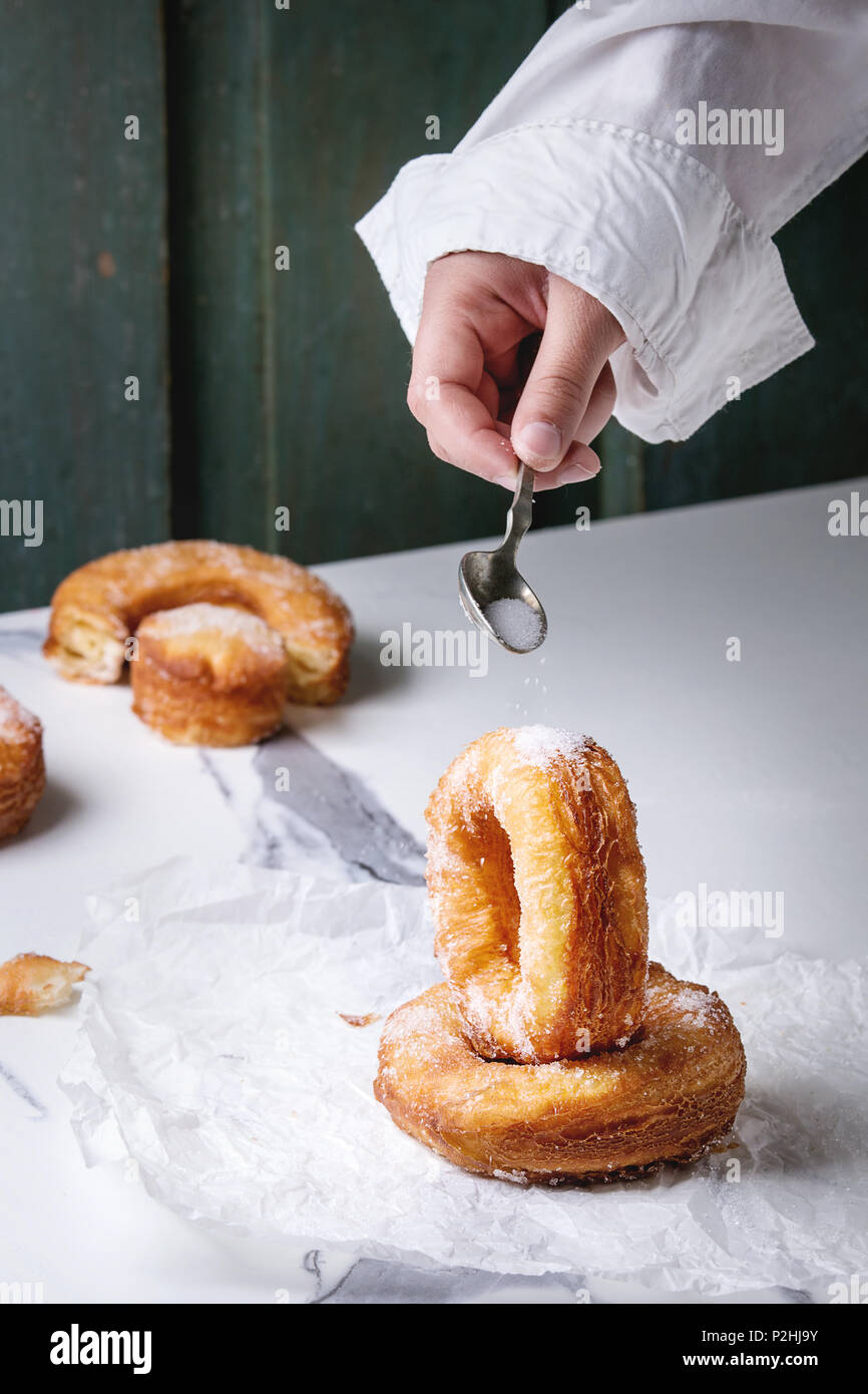Puff pastry donuts cronuts Stock Photo - Alamy