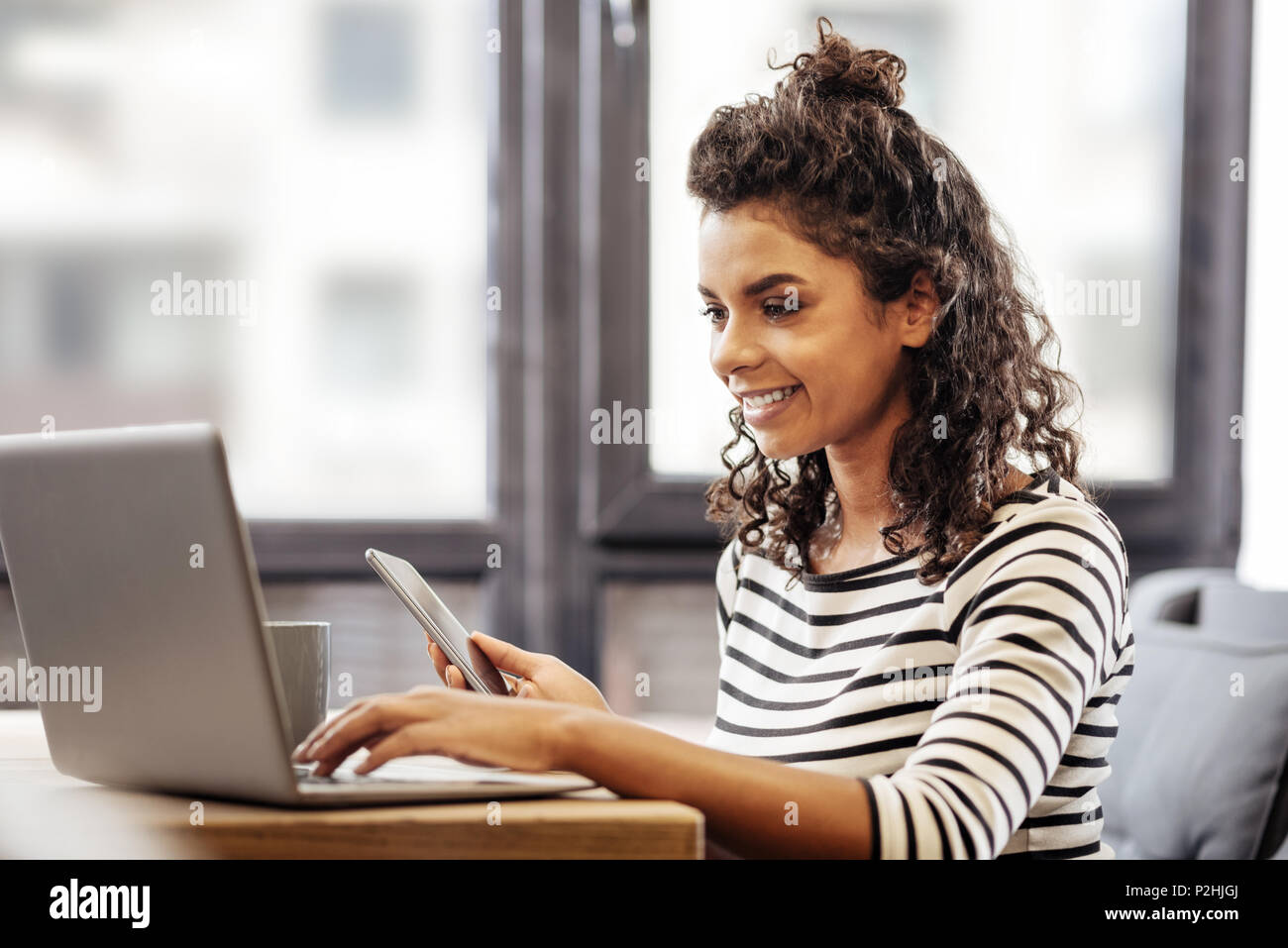 Professional female freelancer working Stock Photo - Alamy
